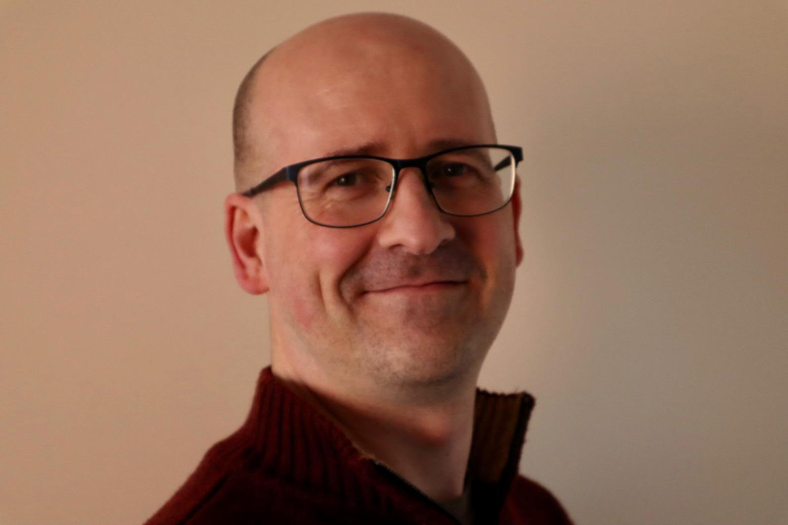 Photo of a therapist called Dominic smiling at the camera